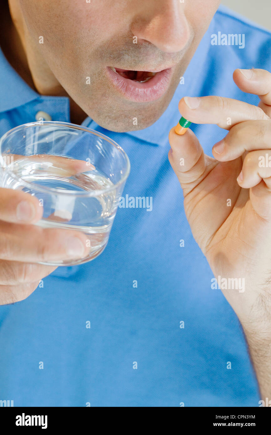 MAN TAKING MEDICATION Stock Photo - Alamy