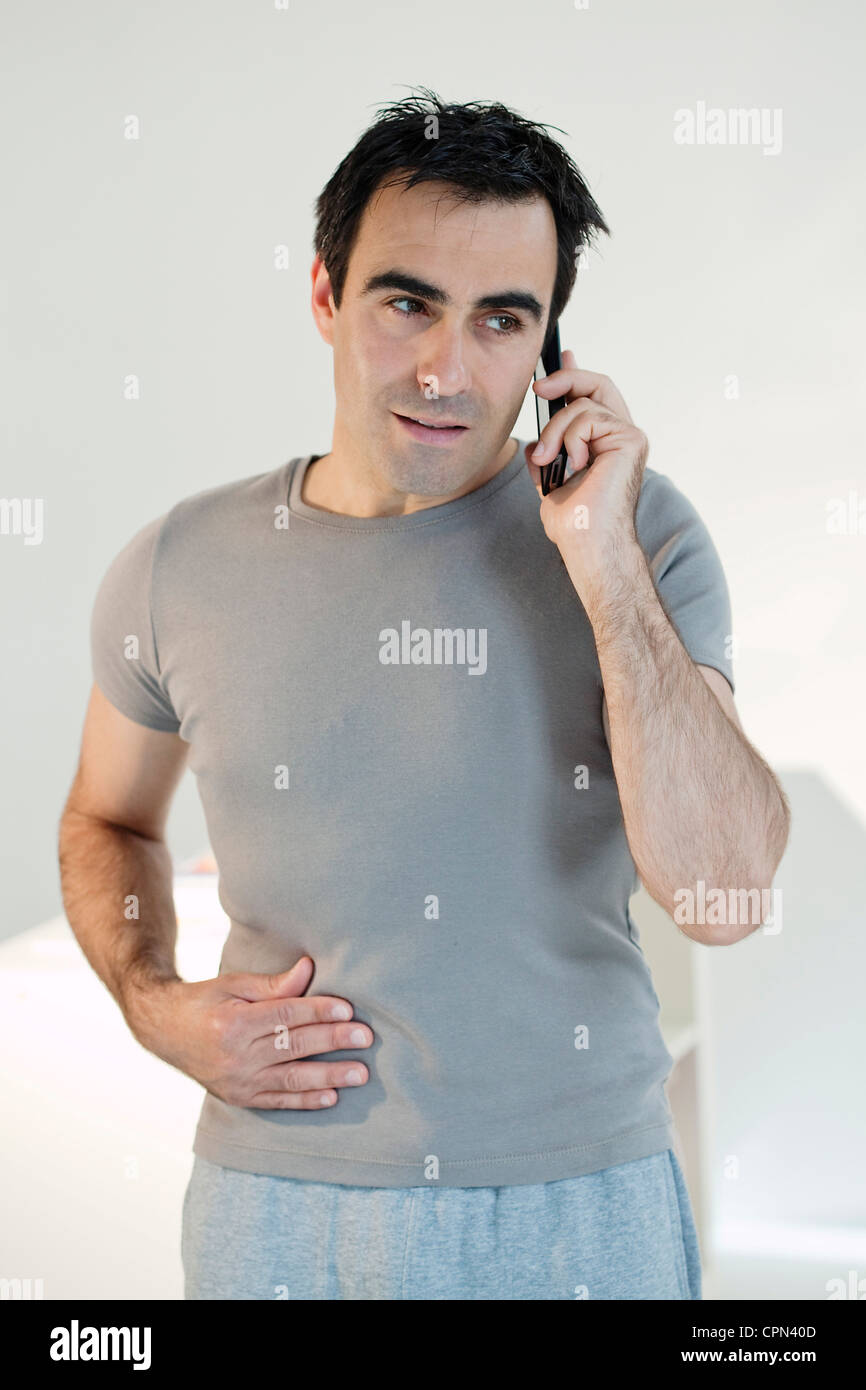 ABDOMINAL PAIN IN A MAN Stock Photo - Alamy