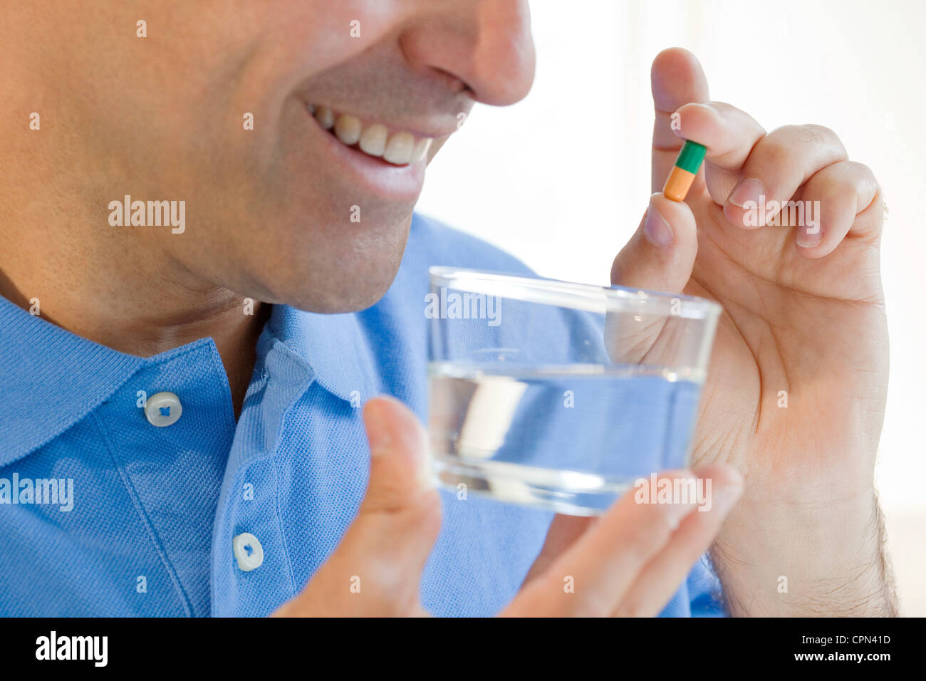 MAN TAKING MEDICATION Stock Photo - Alamy
