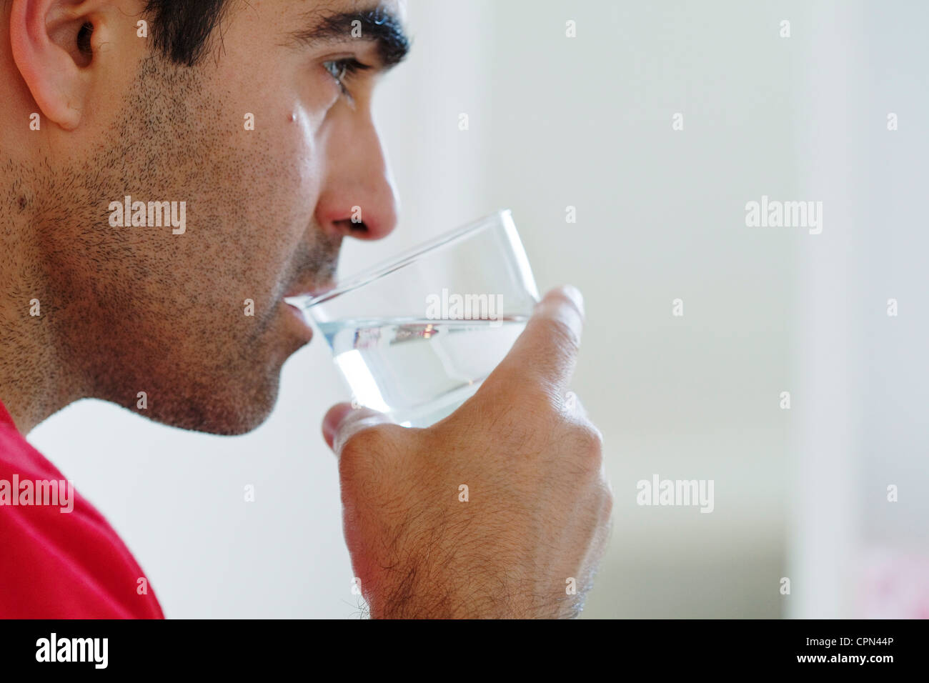 MAN WITH COLD DRINK Stock Photo - Alamy