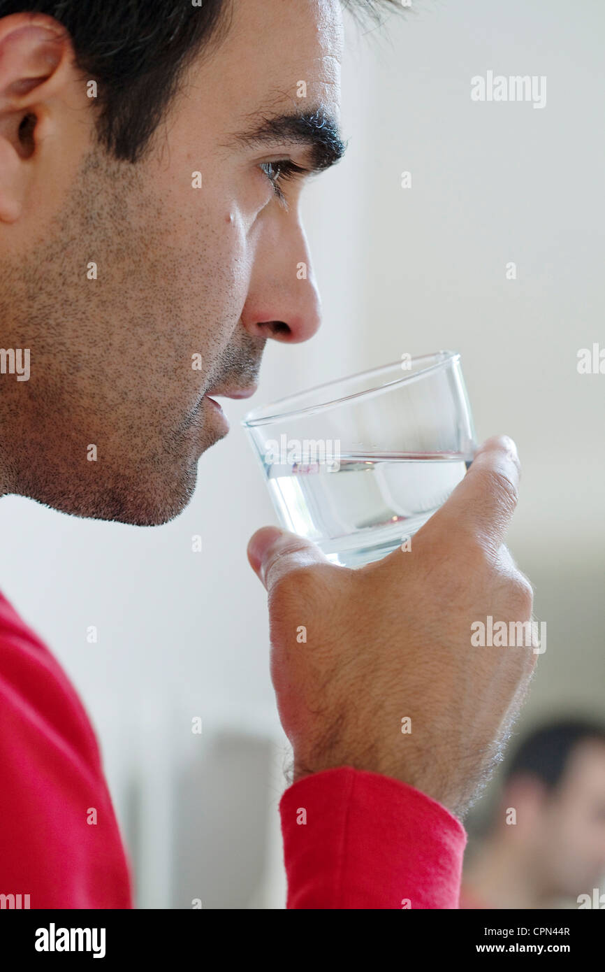 MAN WITH COLD DRINK Stock Photo - Alamy