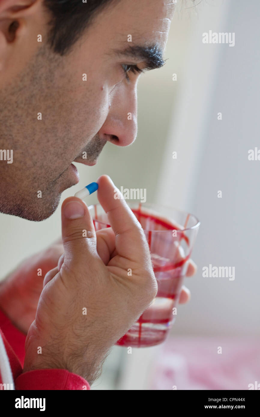 MAN TAKING MEDICATION Stock Photo - Alamy