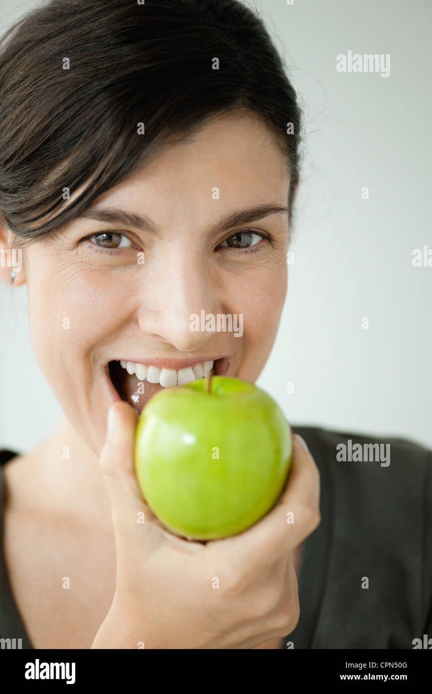 Woman taking bite from fresh hi-res stock photography and images - Alamy