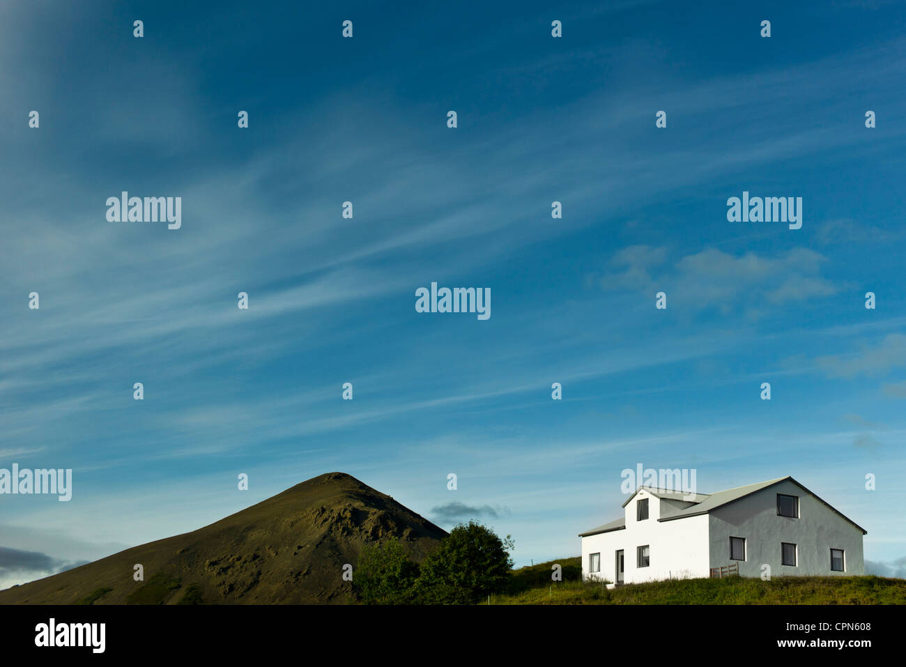 Iceland, rural house and volcanic rock Stock Photo - Alamy
