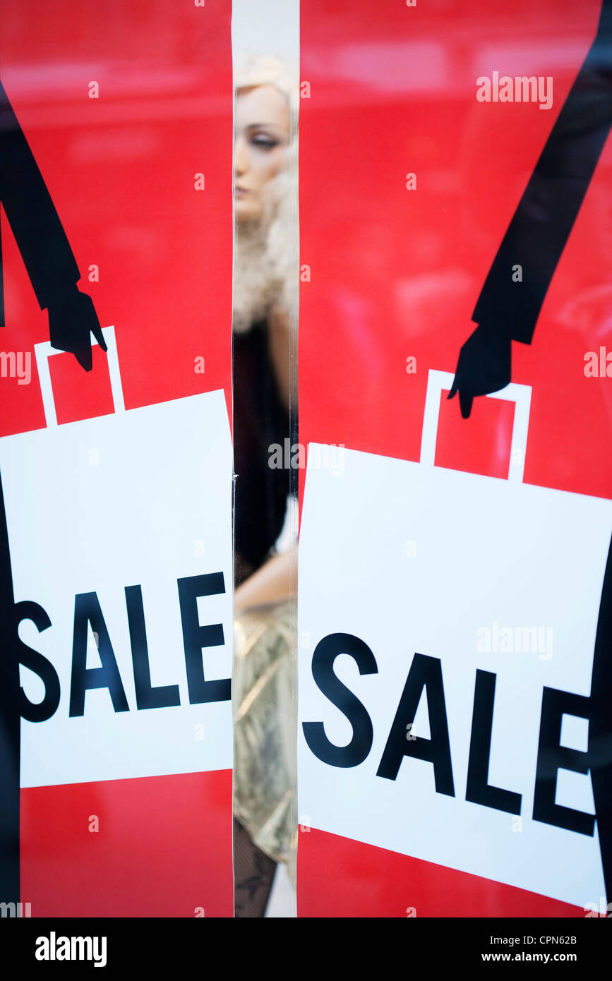 Sale signs in shop window Stock Photo - Alamy