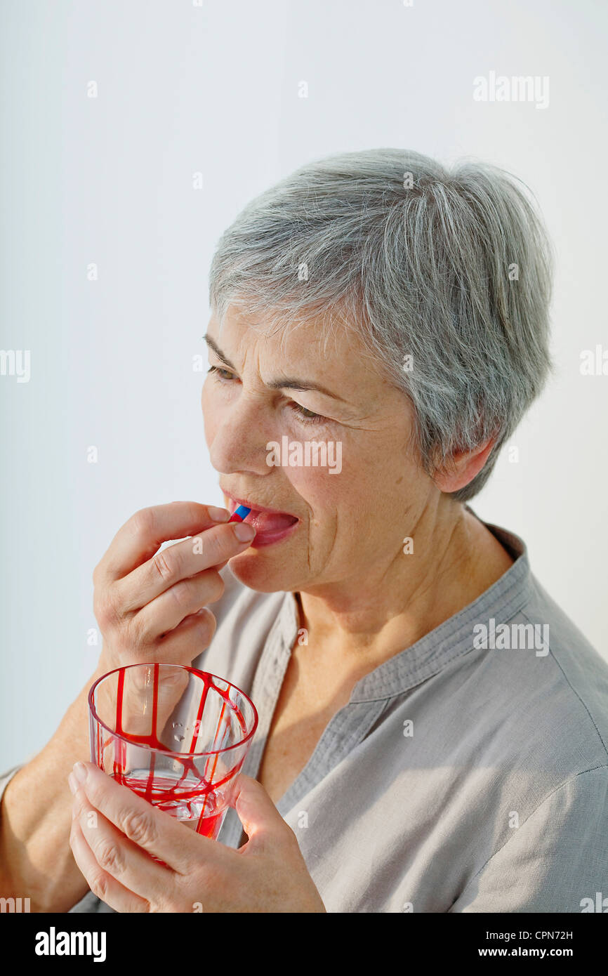 ELDERLY PERSON TAKING MEDICATION Stock Photo - Alamy