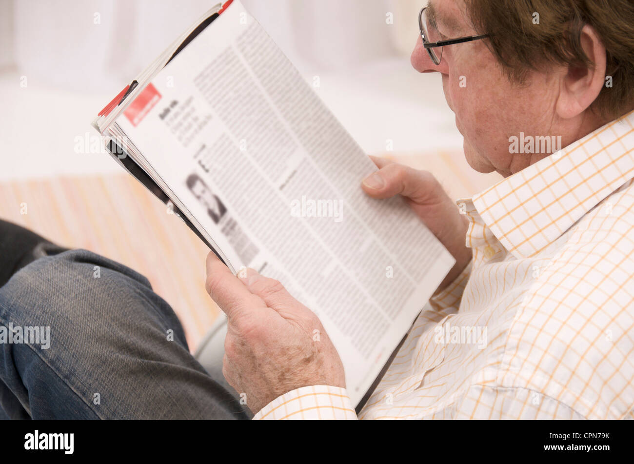 ELDERLY PERSON READING Stock Photo - Alamy