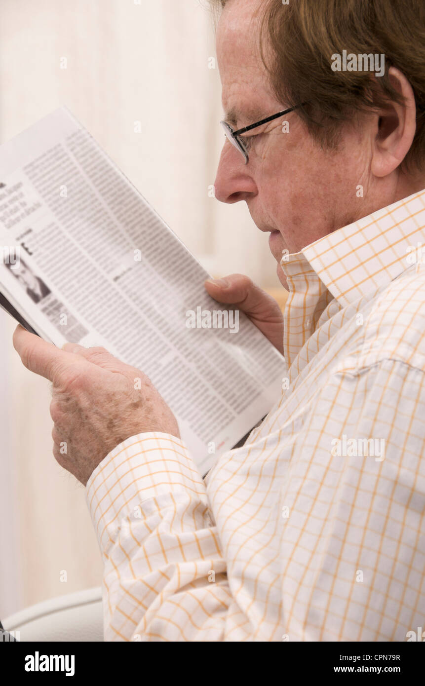 ELDERLY PERSON READING Stock Photo - Alamy