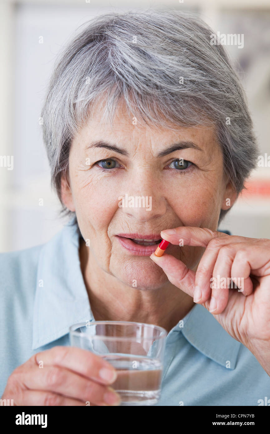 ELDERLY PERSON TAKING MEDICATION Stock Photo - Alamy