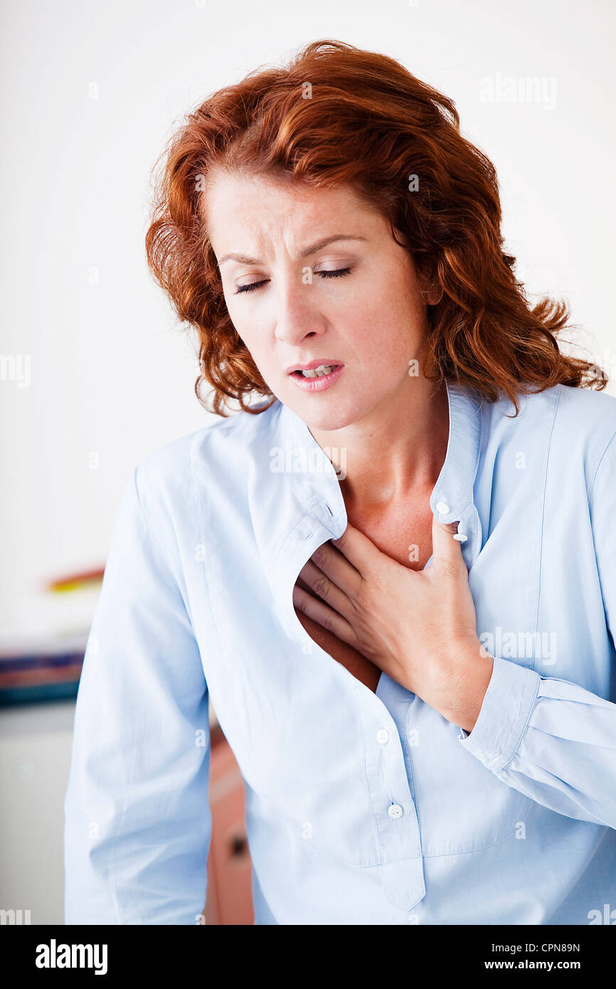 ANGINA PECTORIS WOMAN Stock Photo - Alamy