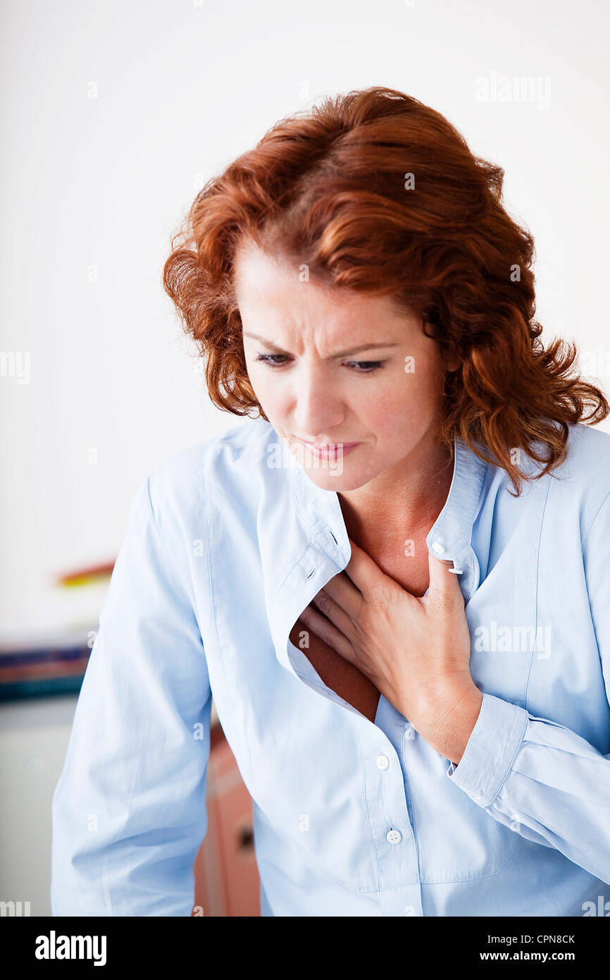 ANGINA PECTORIS WOMAN Stock Photo - Alamy