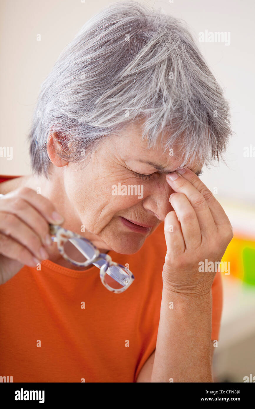 TIRED ELDERLY PERSON Stock Photo - Alamy