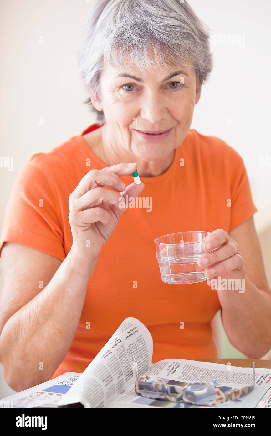 ELDERLY PERSON TAKING MEDICATION Stock Photo - Alamy