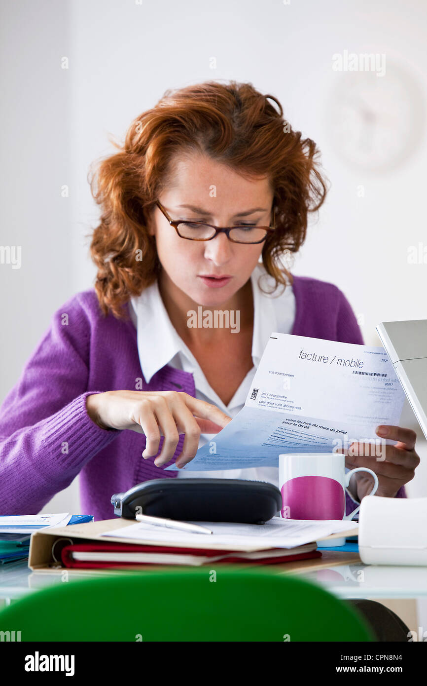 WOMAN DOING PAPERWORK Stock Photo - Alamy