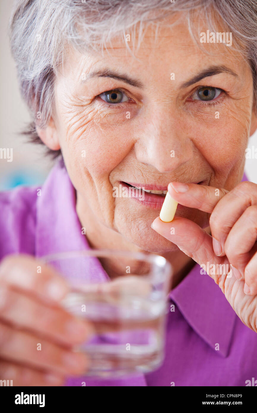 ELDERLY PERSON TAKING MEDICATION Stock Photo - Alamy