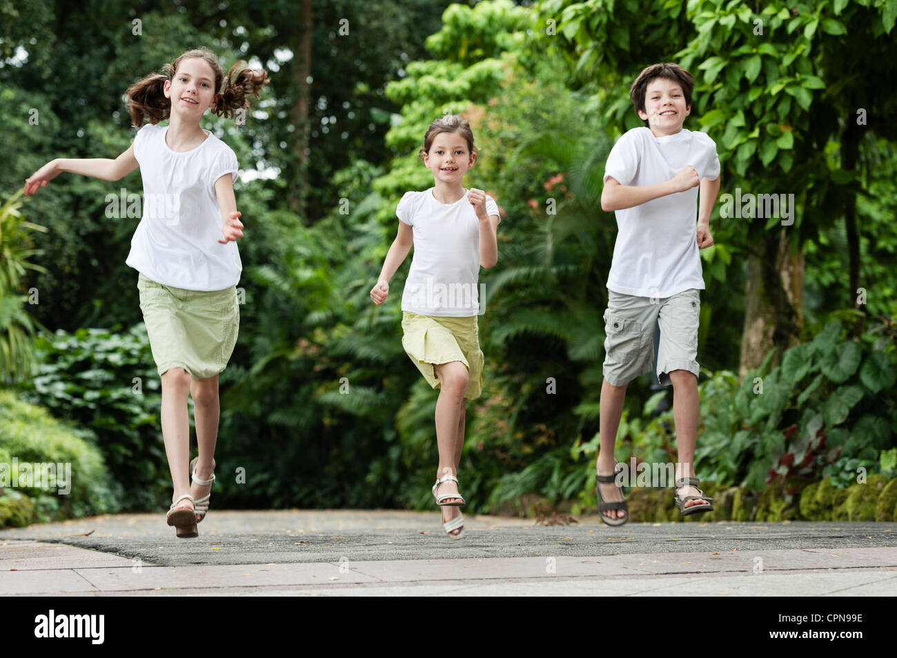 Children running outdoors Stock Photo - Alamy