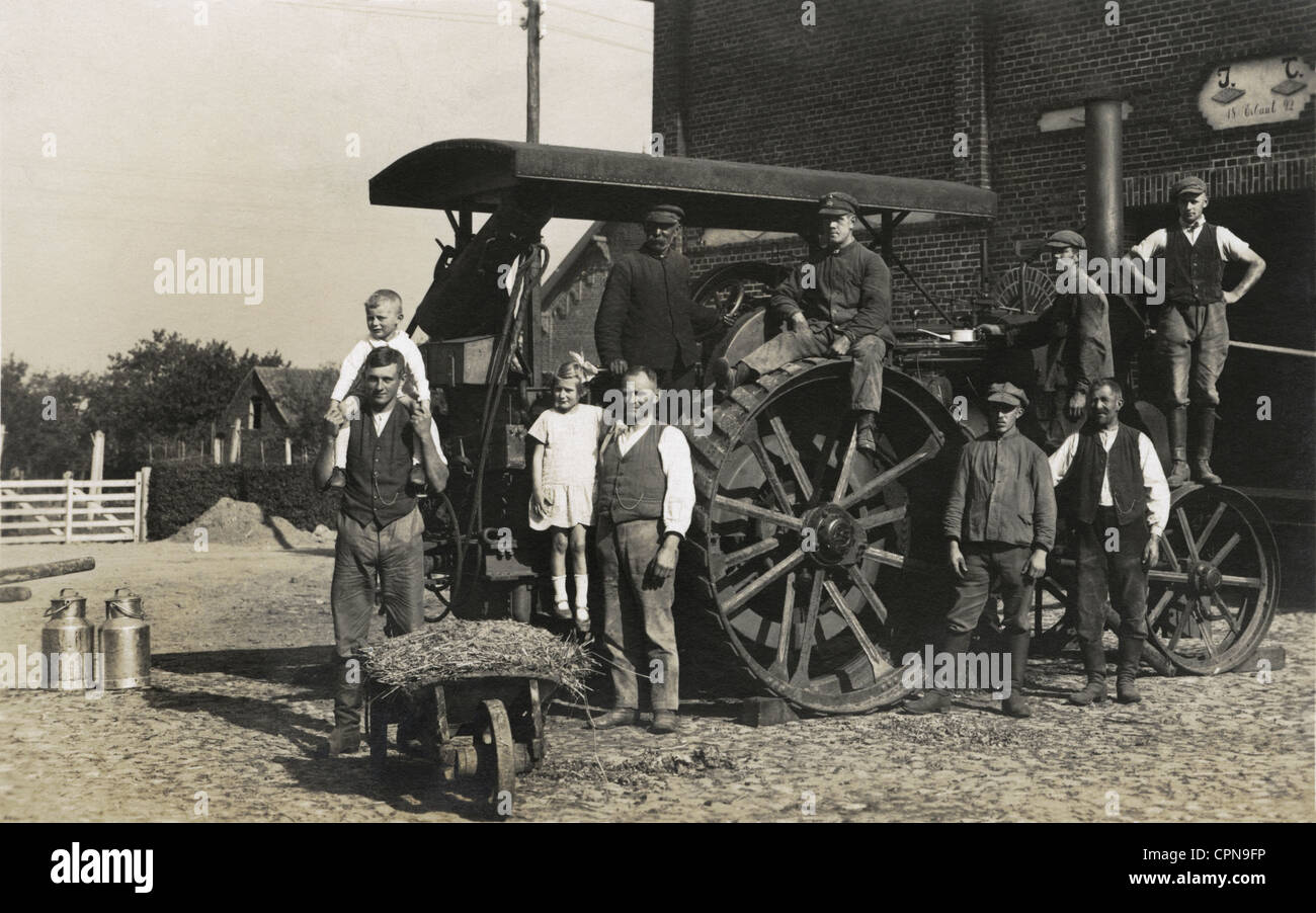 agriculture, machine, agricultural labourers with big tractor, powered ...