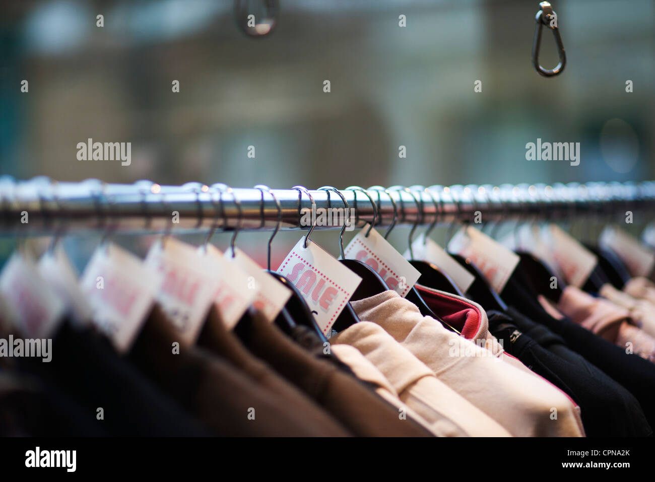 Sale tags on clothing in store, cropped Stock Photo - Alamy