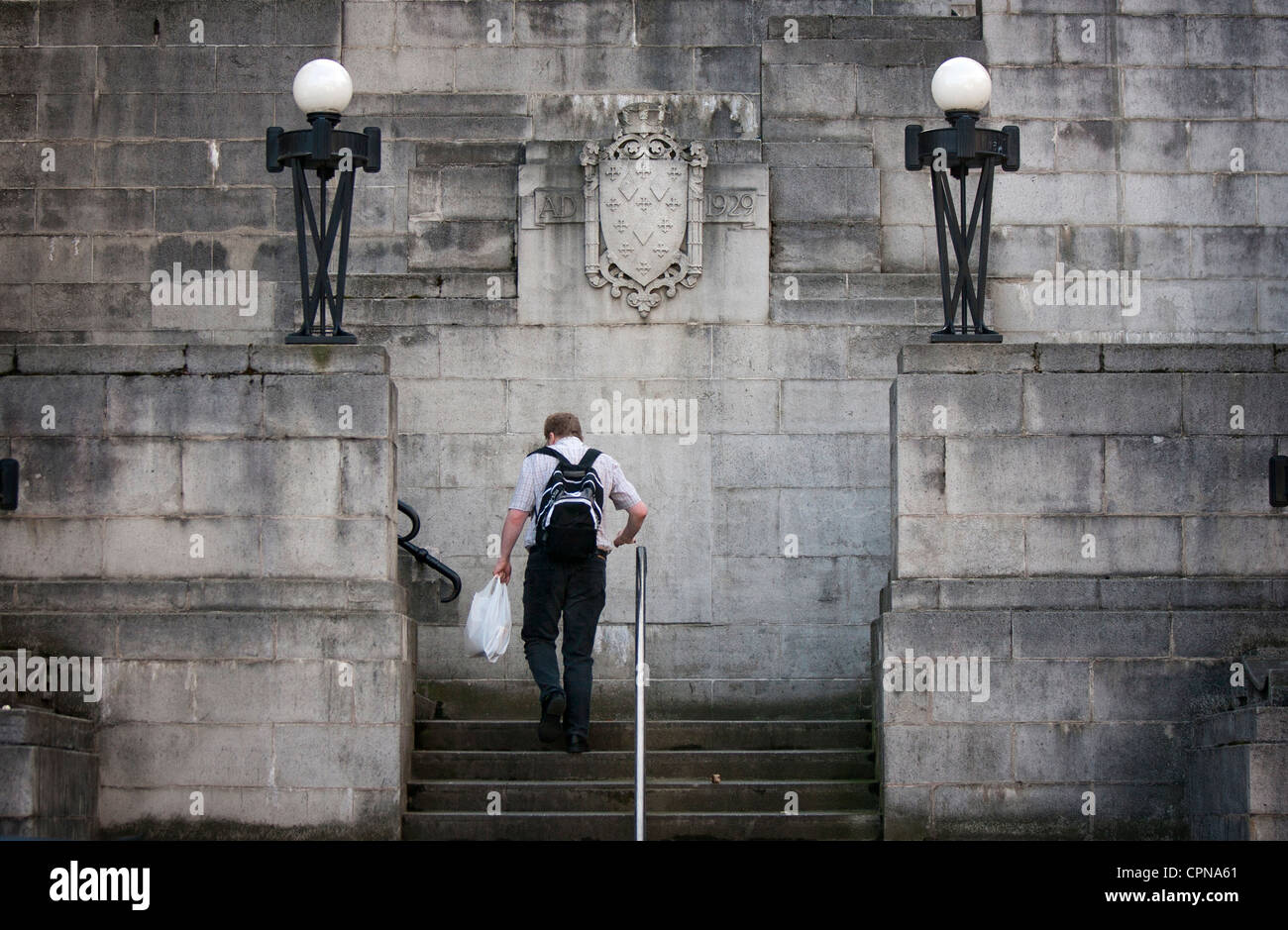 A man walking up Stockport town center's concrete Plaza Steps Stock ...