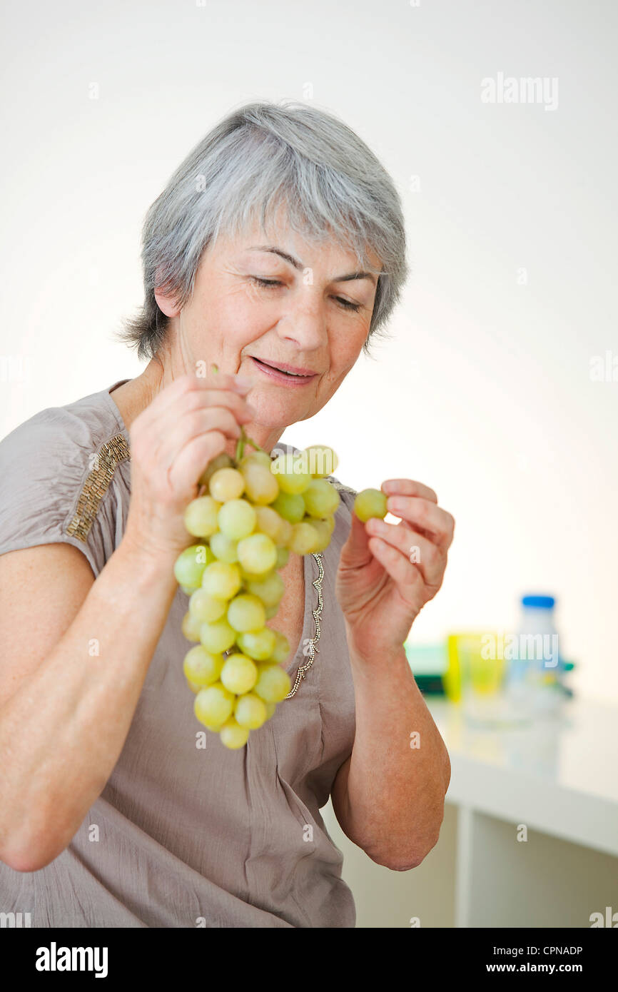 ELDERLY PERSON EATING FRUIT Stock Photo - Alamy