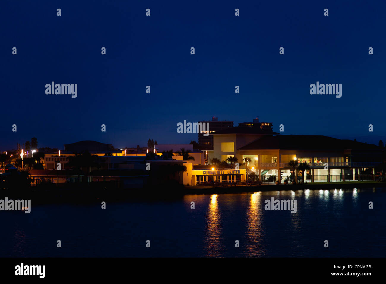 Waterfront buildings illuminated at night Stock Photo - Alamy