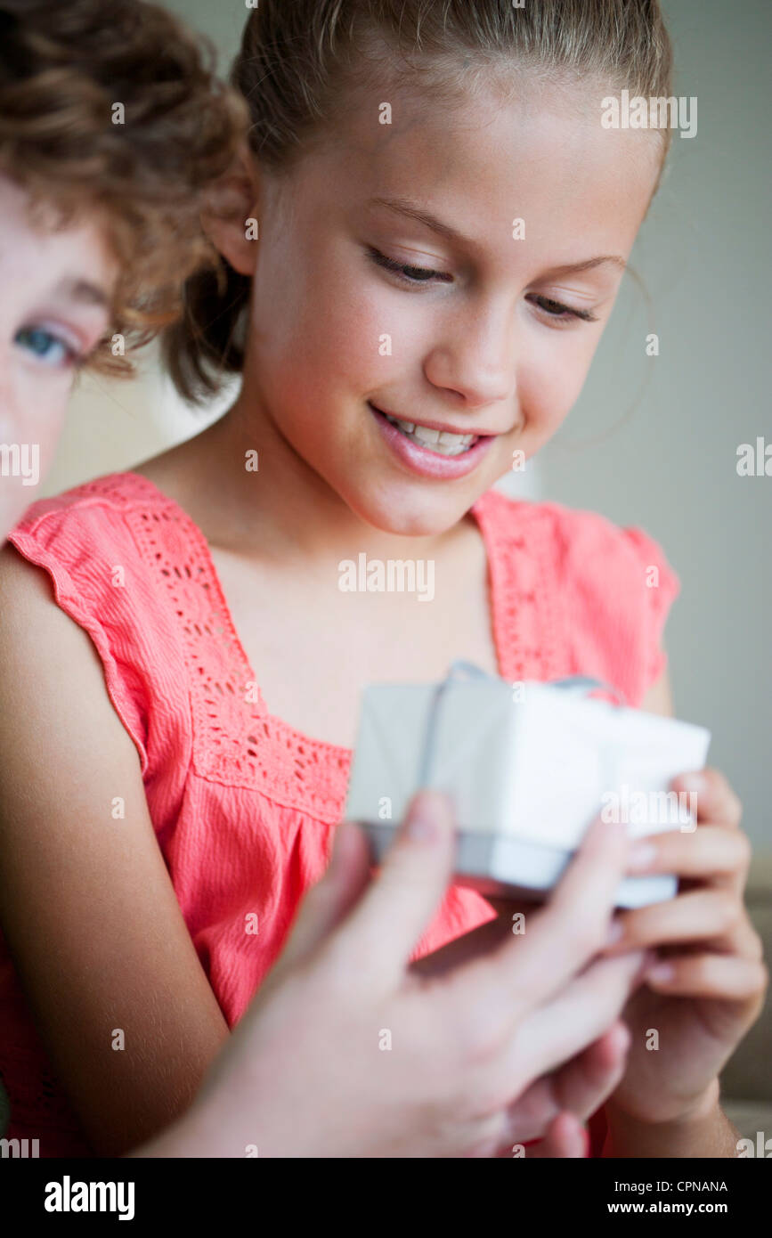 Girl receiving gift, cropped Stock Photo - Alamy