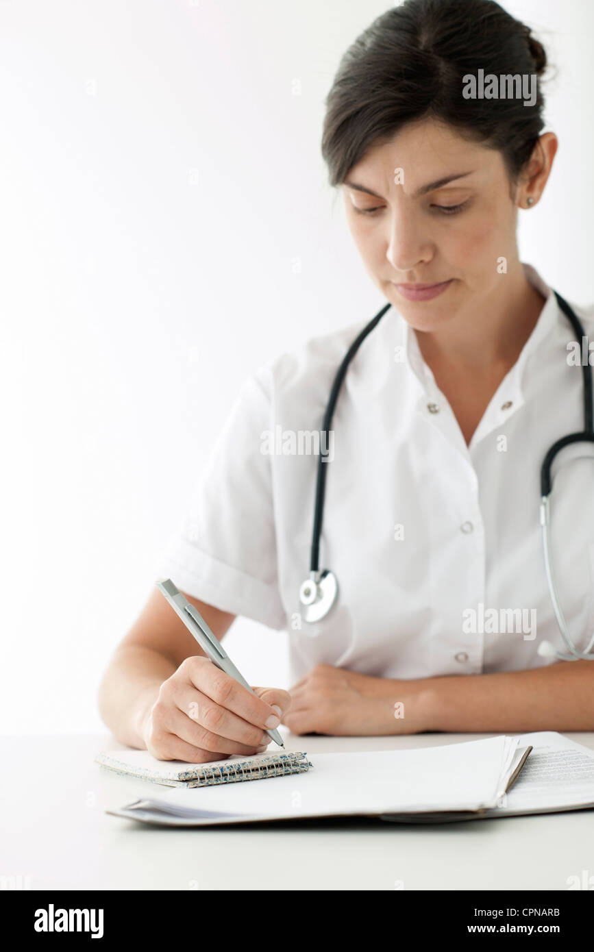 Doctor writing notes Stock Photo - Alamy