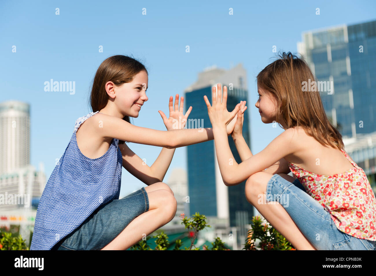Girls playing others hair hi-res stock photography and images - Alamy