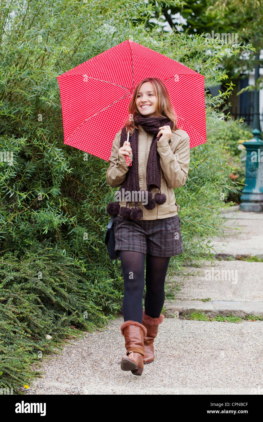 Mature woman outside walking rain hi-res stock photography and images ...