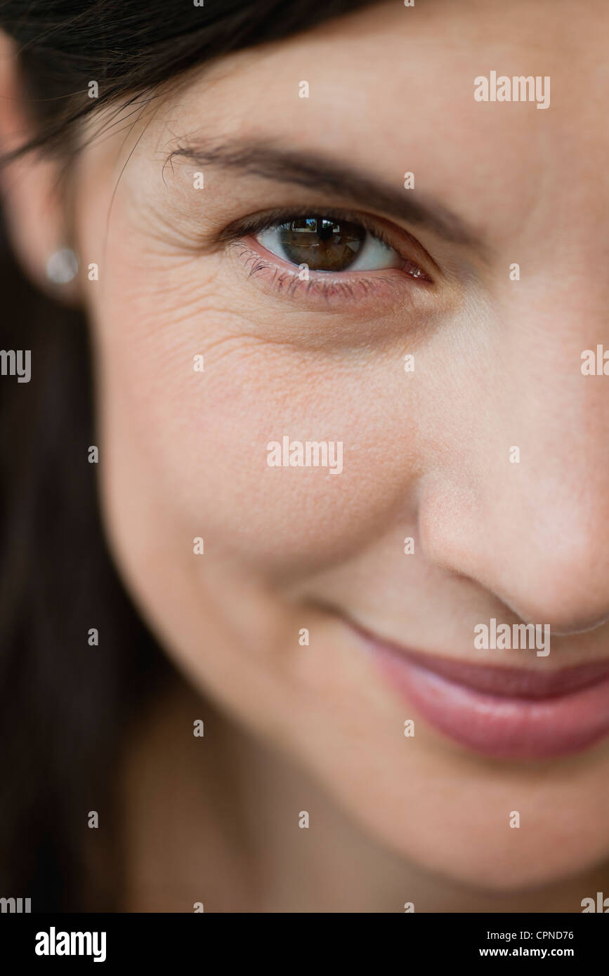 Smiling mid-adult woman, cropped portrait Stock Photo - Alamy