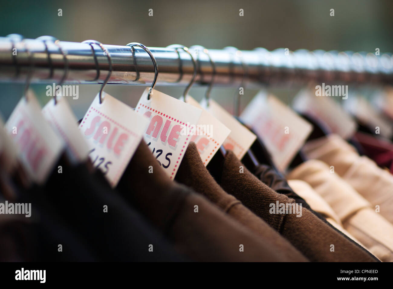 Sale tags on clothing in store, cropped Stock Photo - Alamy