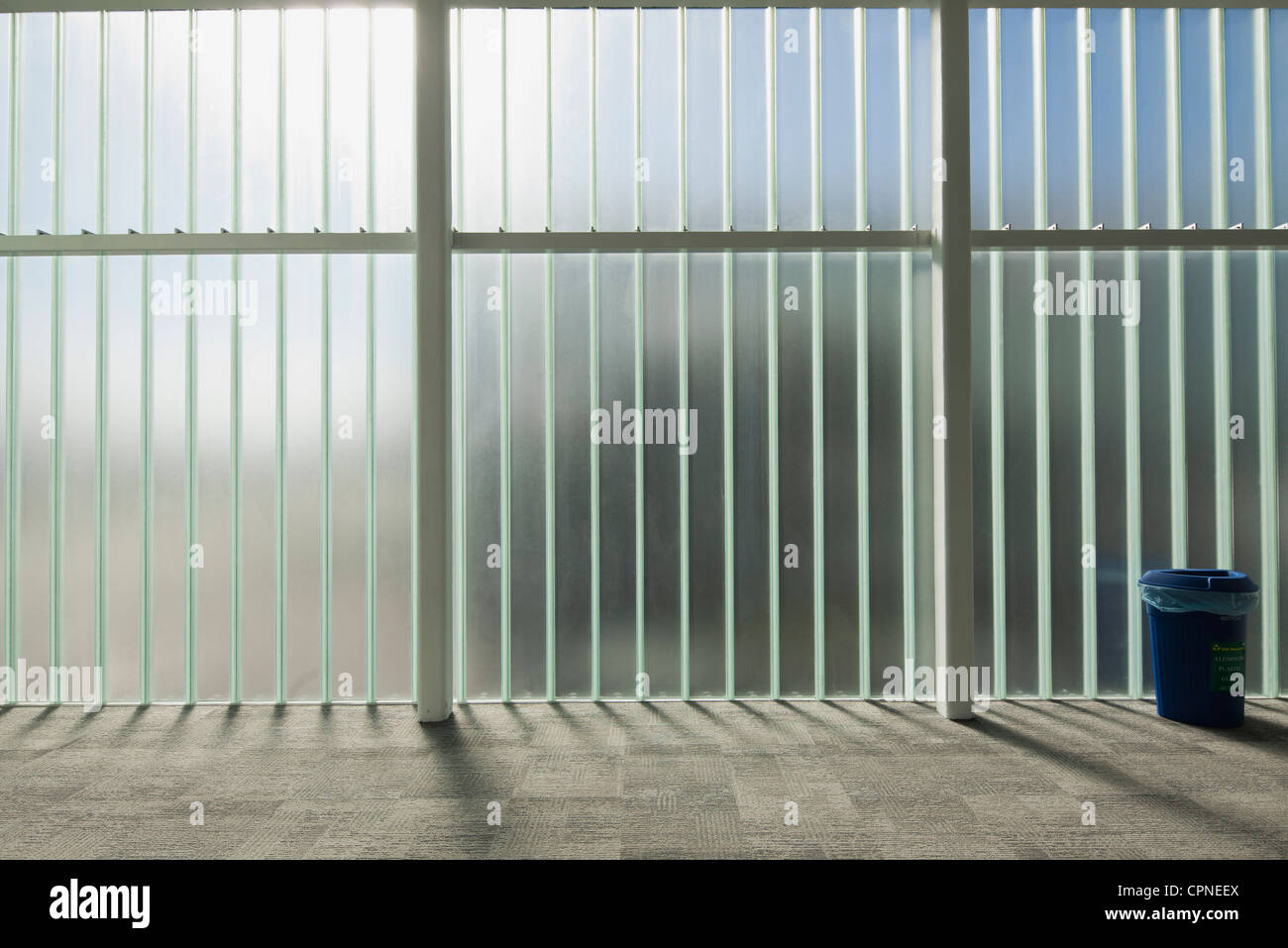 Glass wall in lobby Stock Photo - Alamy