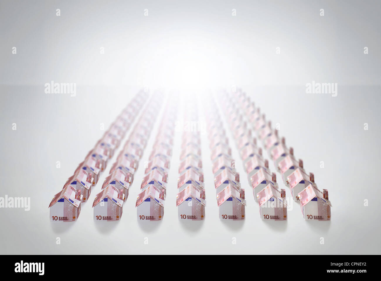 Ten Euro banknotes folded into the shapes of houses Stock Photo - Alamy