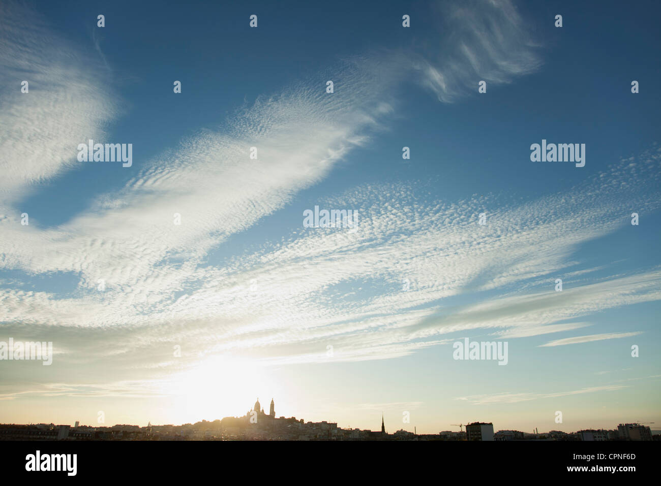 Sun setting over distant skyline of Paris, France Stock Photo - Alamy