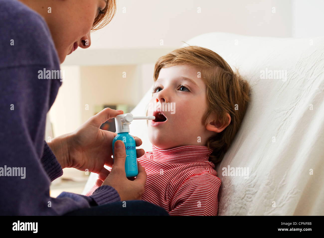 Child using spray in mouth hi-res stock photography and images - Alamy