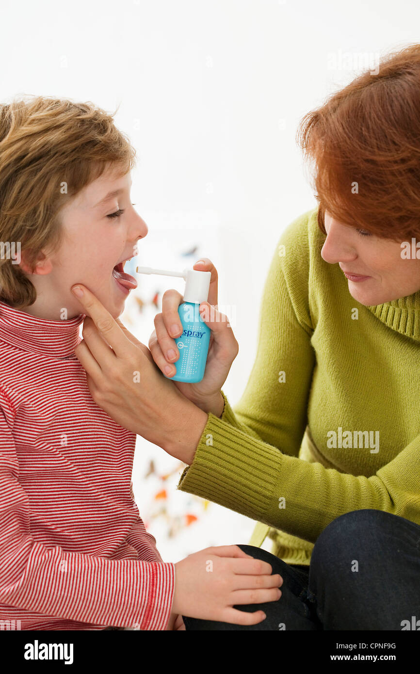 Child using spray in mouth hi-res stock photography and images - Alamy