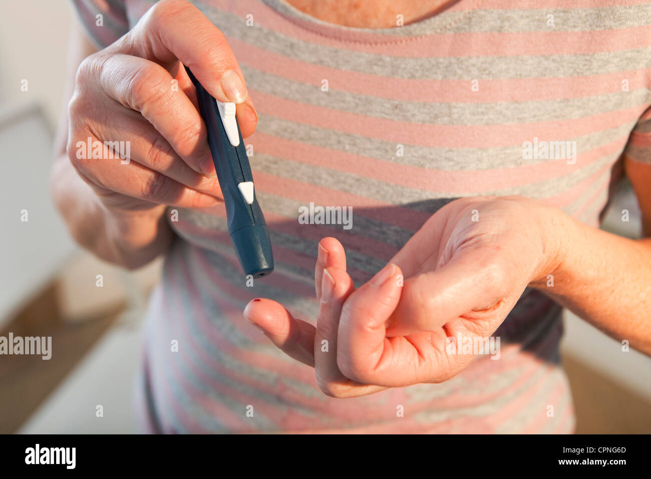 TEST FOR DIABETES ELDERLY PERSON Stock Photo - Alamy
