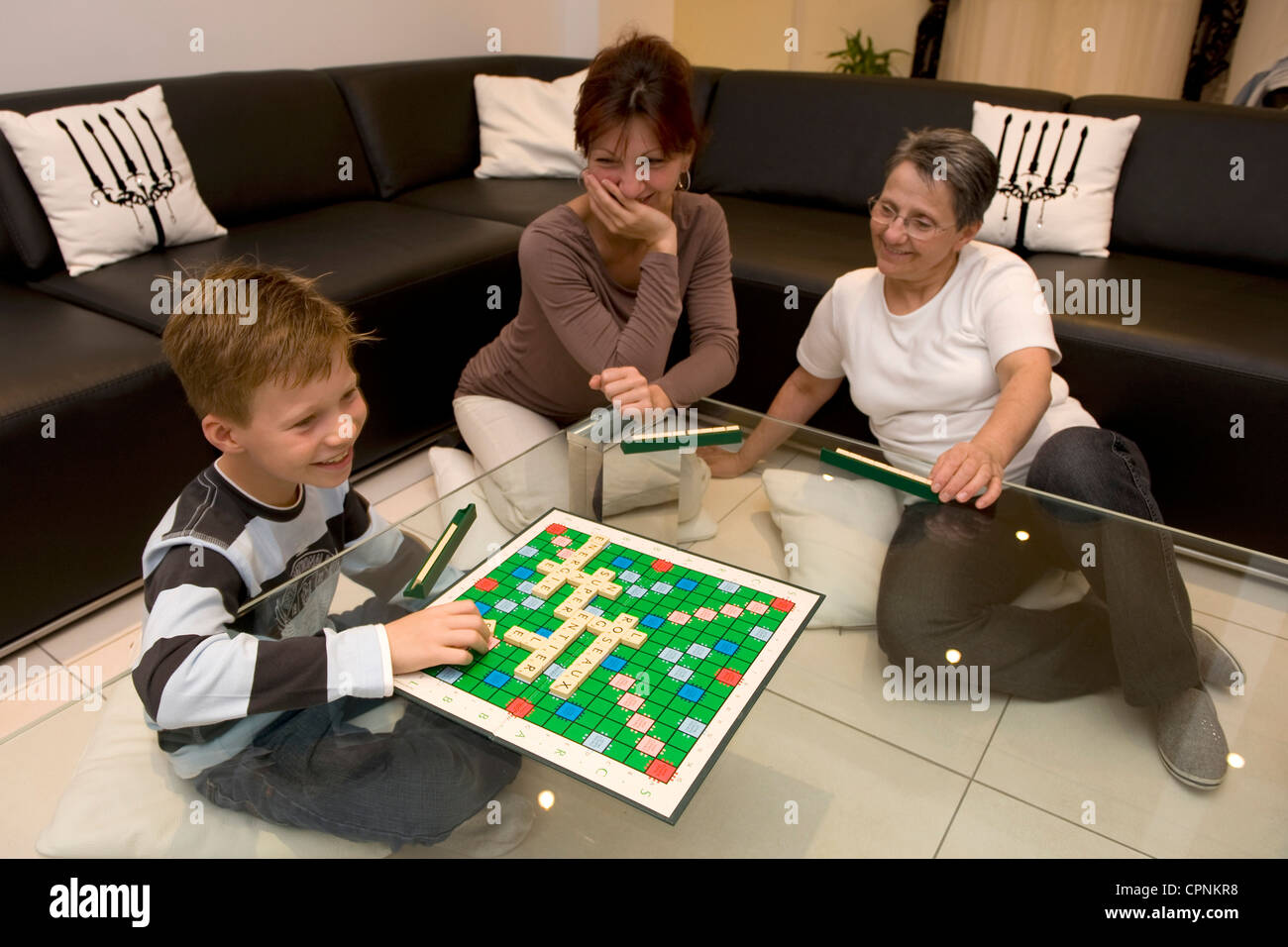 FAMILY PLAYING INDOORS Stock Photo - Alamy