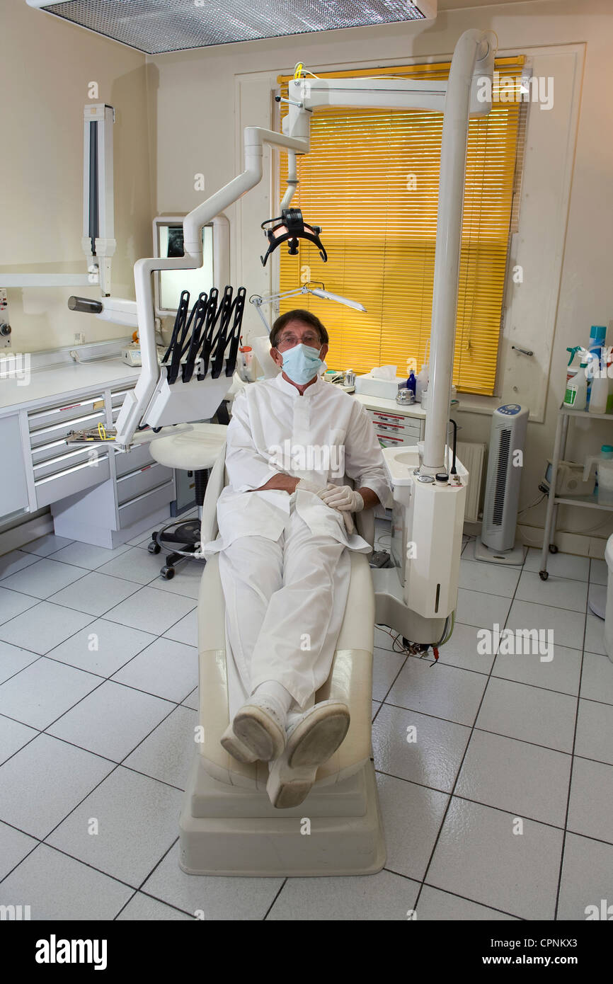 Dentist sits hi-res stock photography and images - Alamy