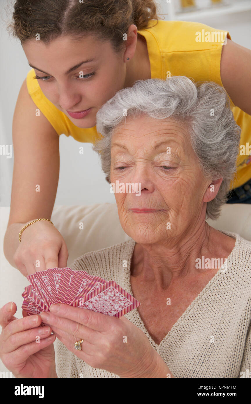 Granddaughter playing cards grandma hi-res stock photography and images ...