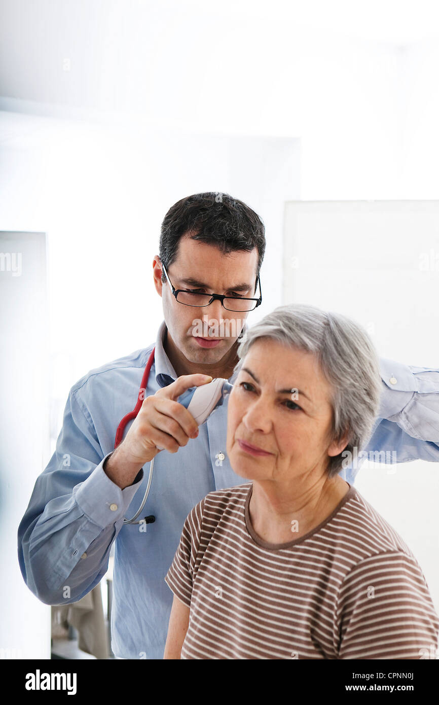 TEMPERATURE ELDERLY PERSON Stock Photo - Alamy