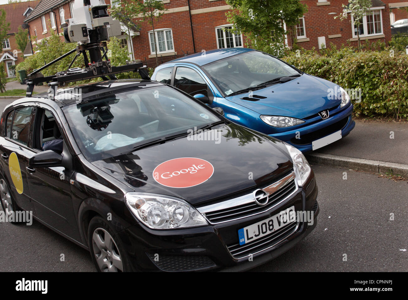 A Google Street Car drives through a residential street collecting ...