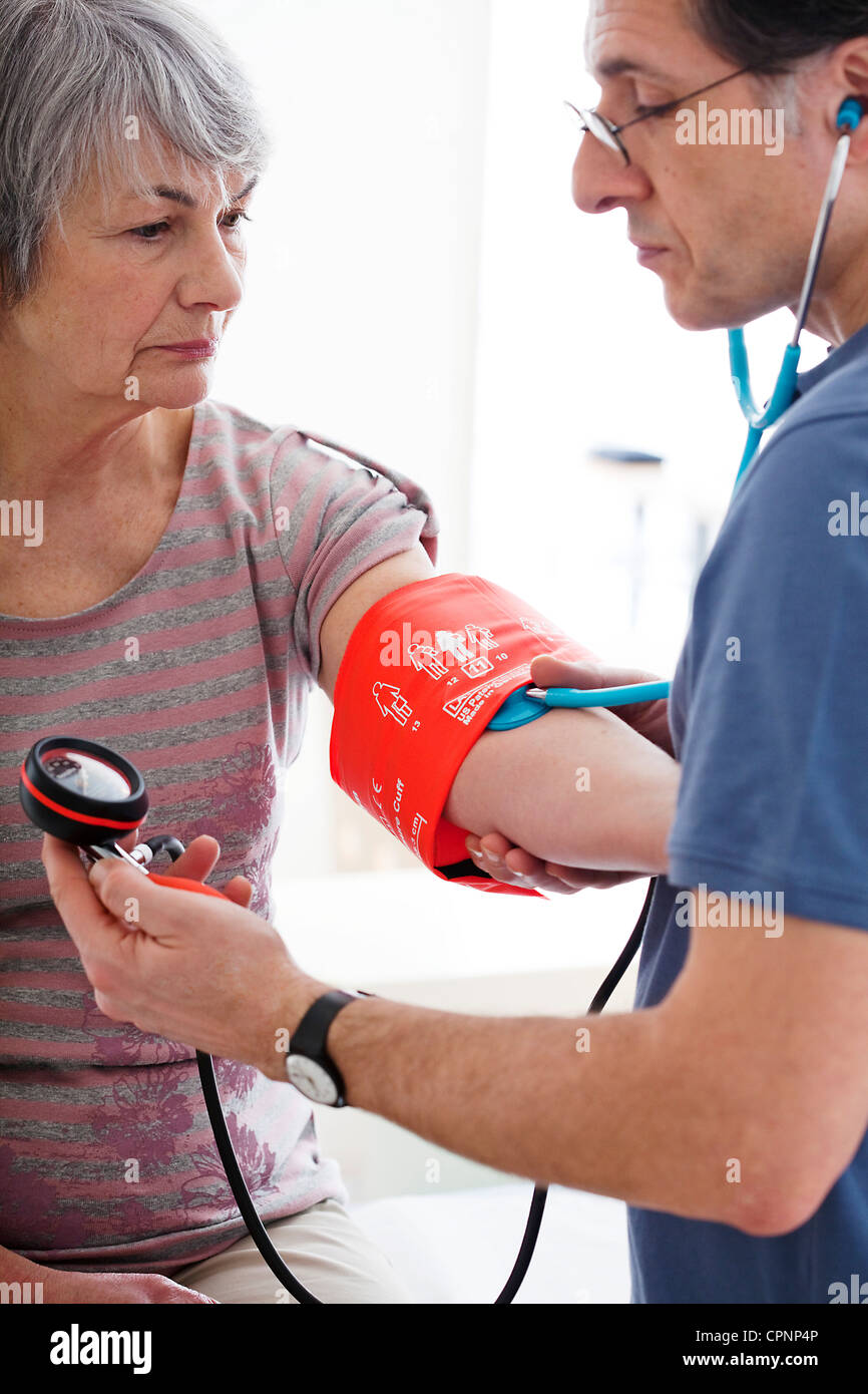 BLOOD PRESSURE, ELDERLY PERSON Stock Photo - Alamy
