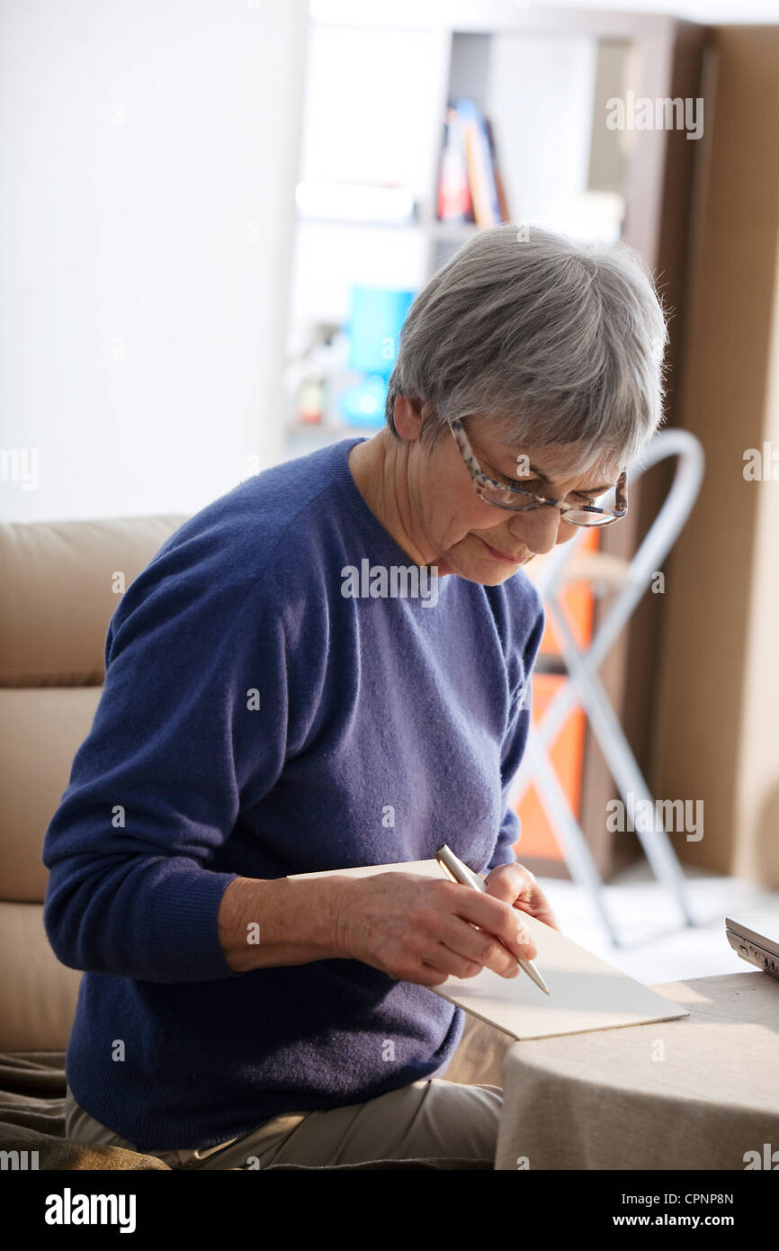 ELDERLY PERSON WRITING Stock Photo - Alamy