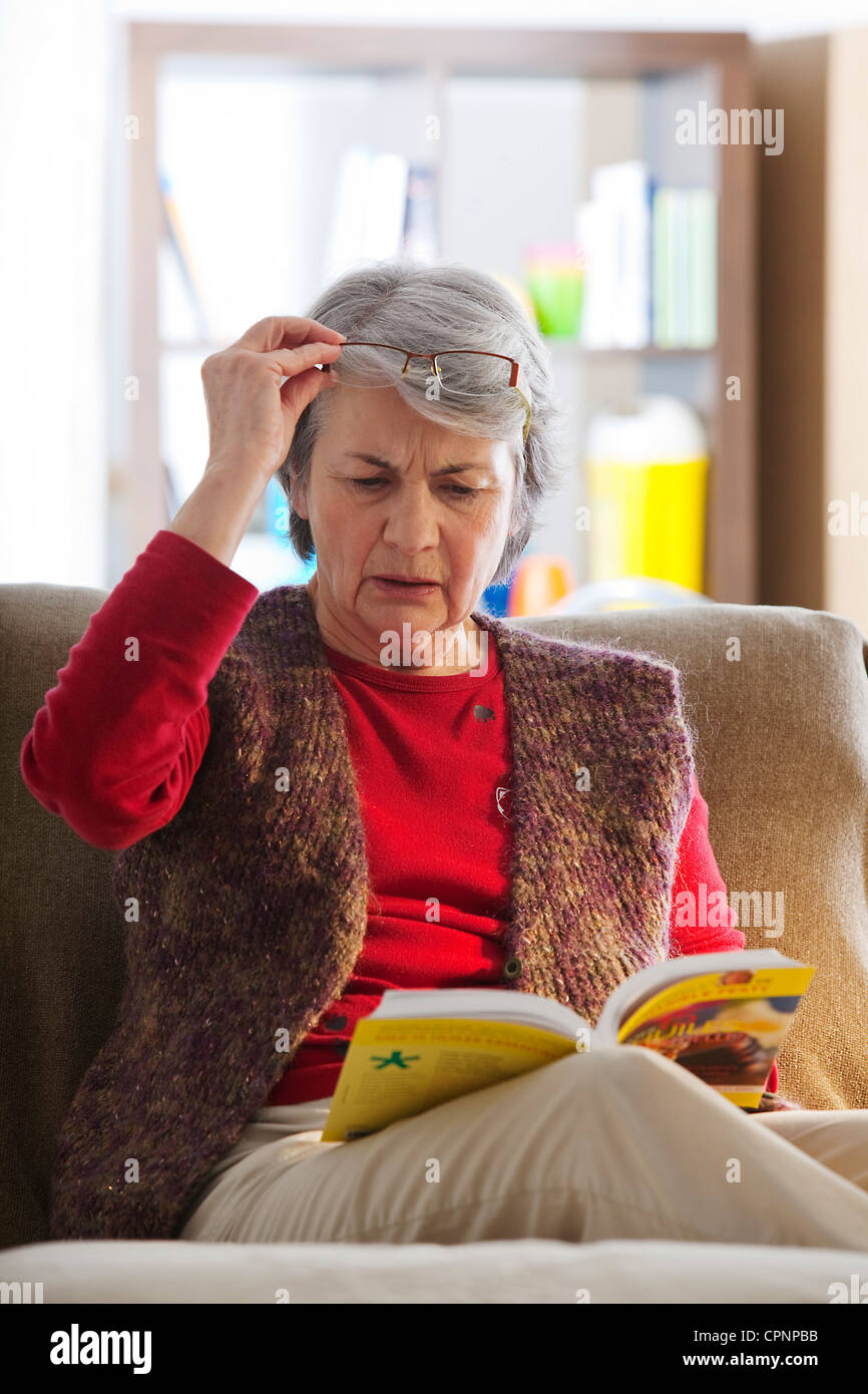 ELDERLY PERSON READING Stock Photo - Alamy