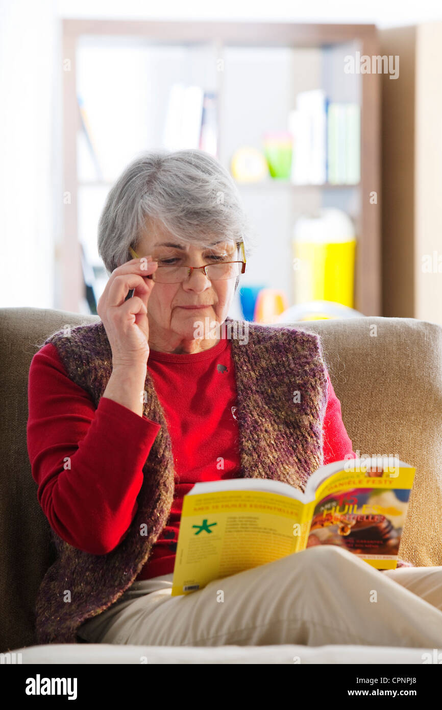 ELDERLY PERSON READING Stock Photo - Alamy