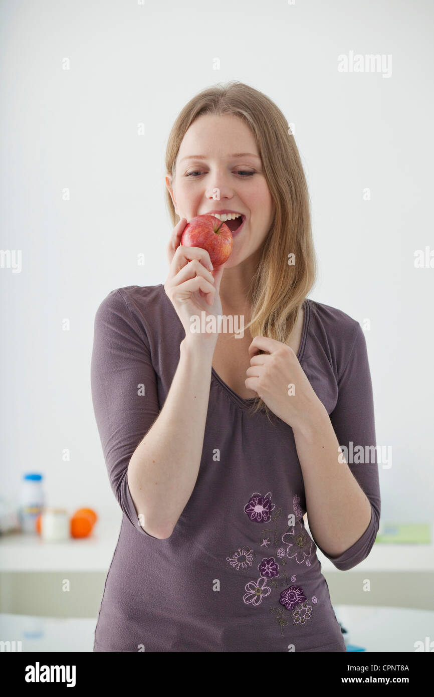 ADOLESCENT EATING FRUIT Stock Photo - Alamy