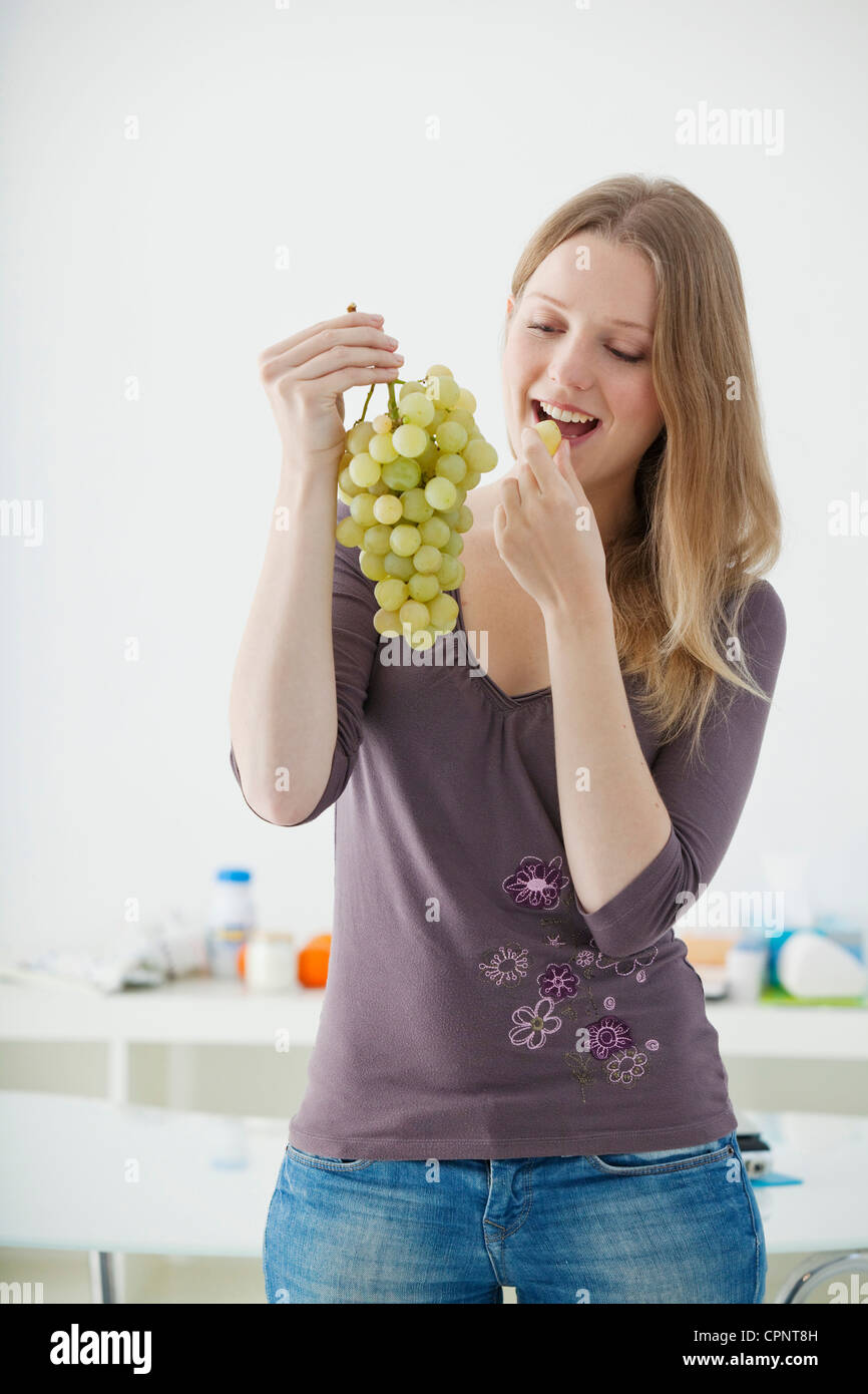 ADOLESCENT EATING FRUIT Stock Photo - Alamy