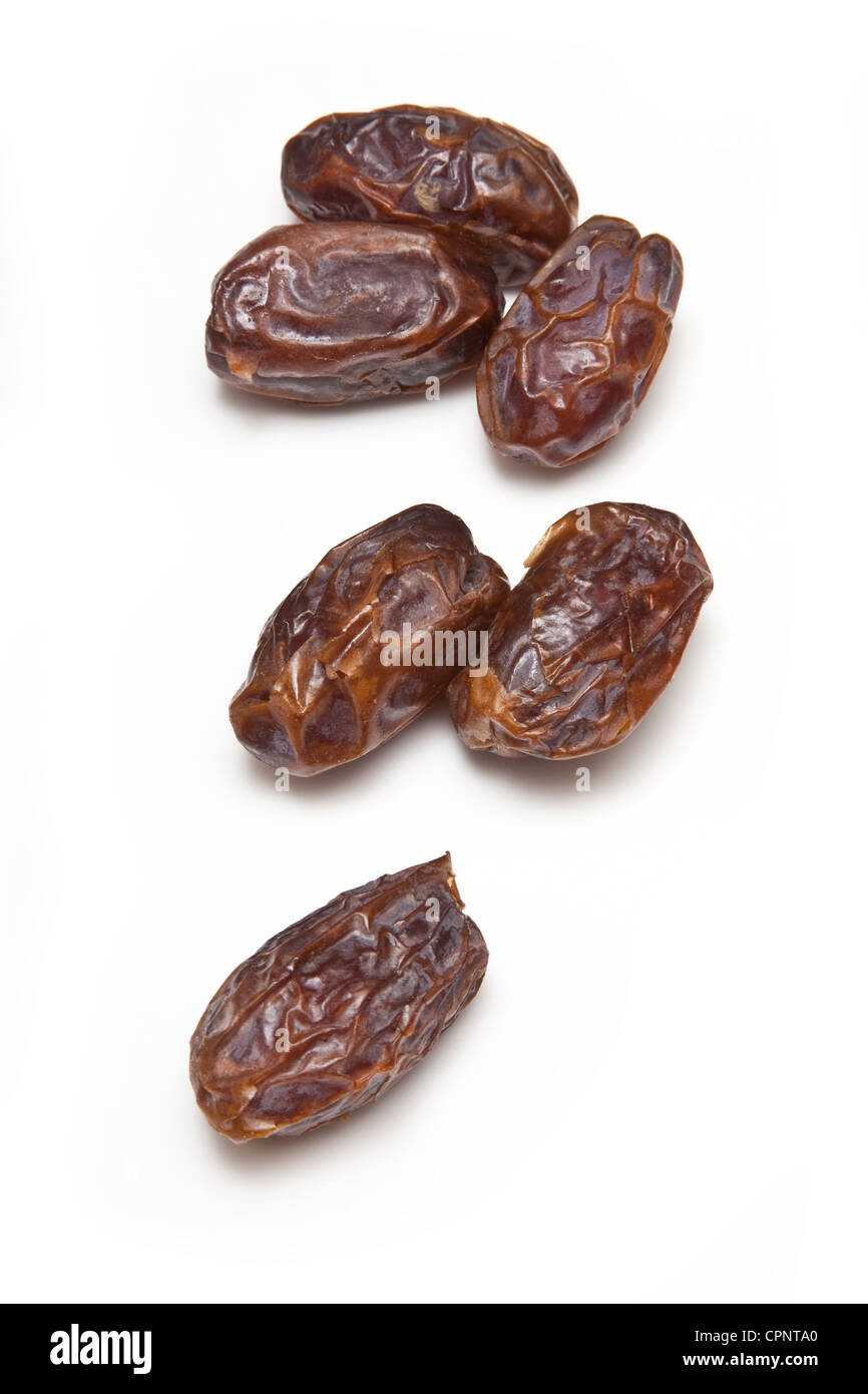 Dried Medjool dates isolated on a white studio background Stock Photo ...