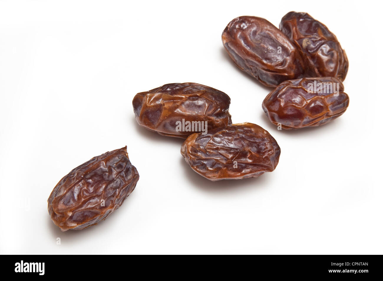 Dried Medjool dates isolated on a white studio background Stock Photo ...